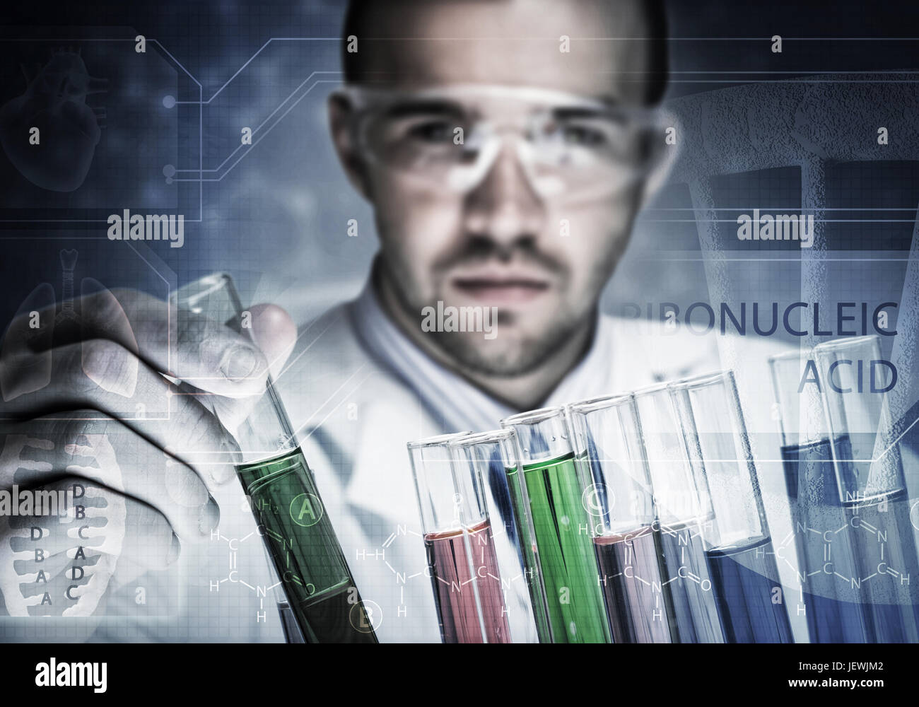 Portrait of concentrated male scientist working with reagents in ...