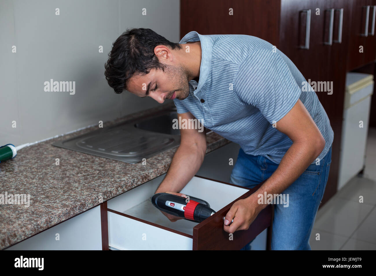 Man using cordless hand drill Stock Photo - Alamy