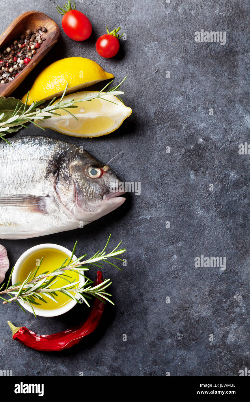 Raw fish cooking and ingredients. Dorado, lemon, herbs and spices. Top ...