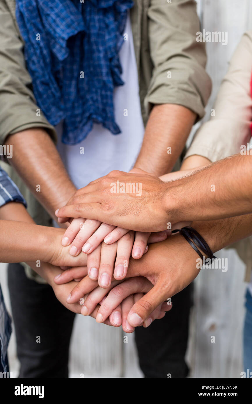 Friends putting their hands together Stock Photo - Alamy