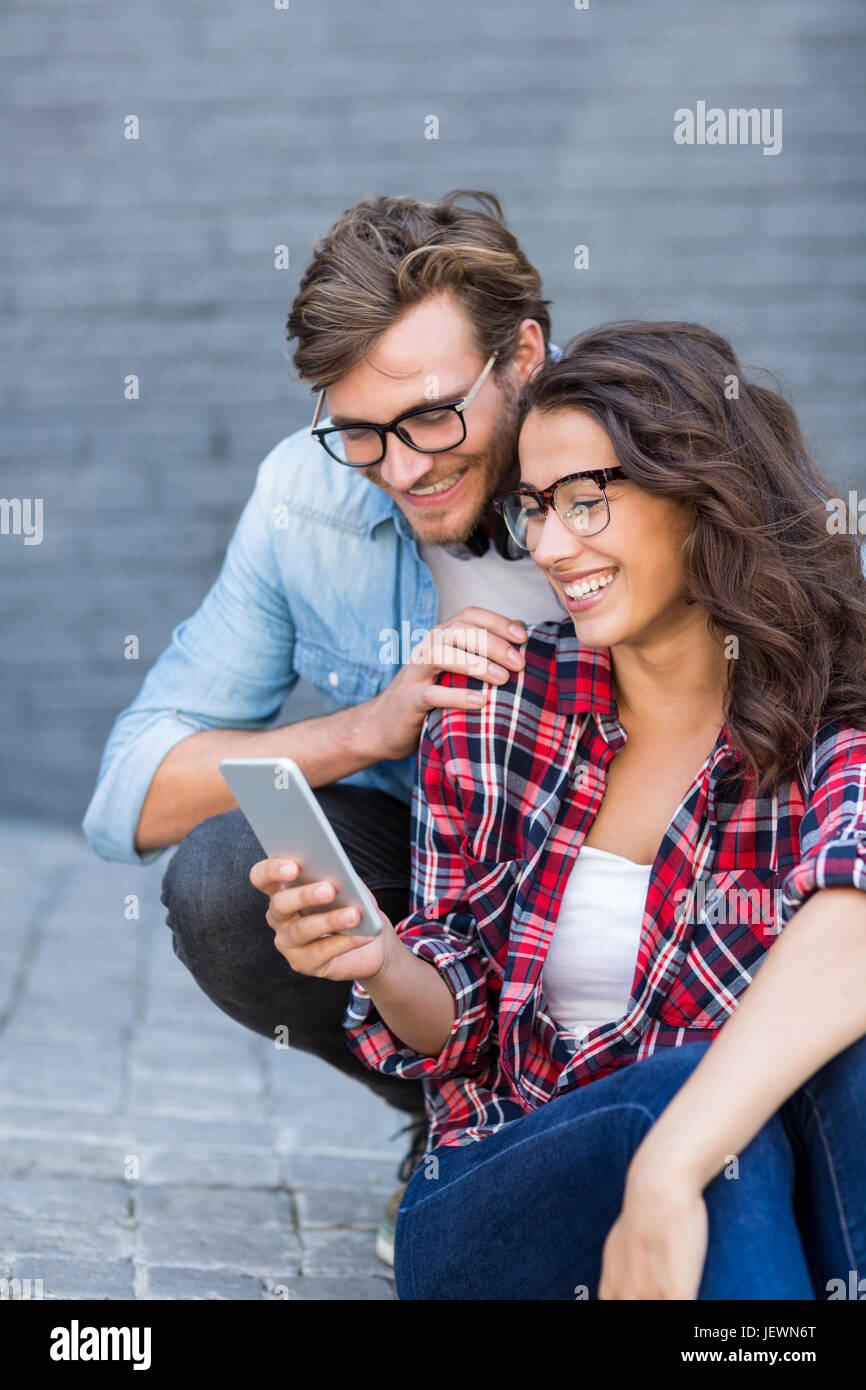 Couple interacting using mobile phone hi-res stock photography and ...