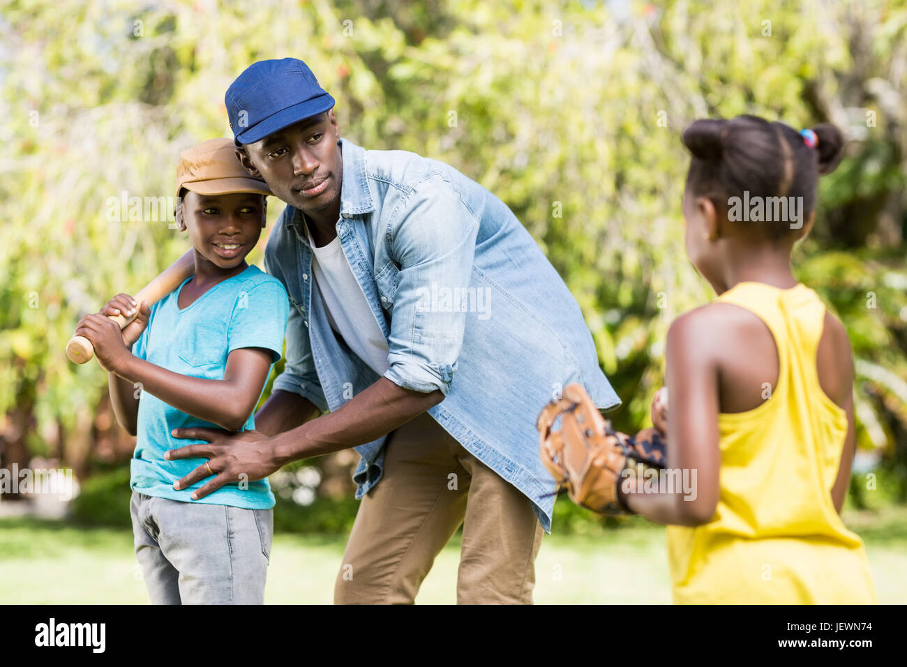 Happy family playing together Stock Photo - Alamy