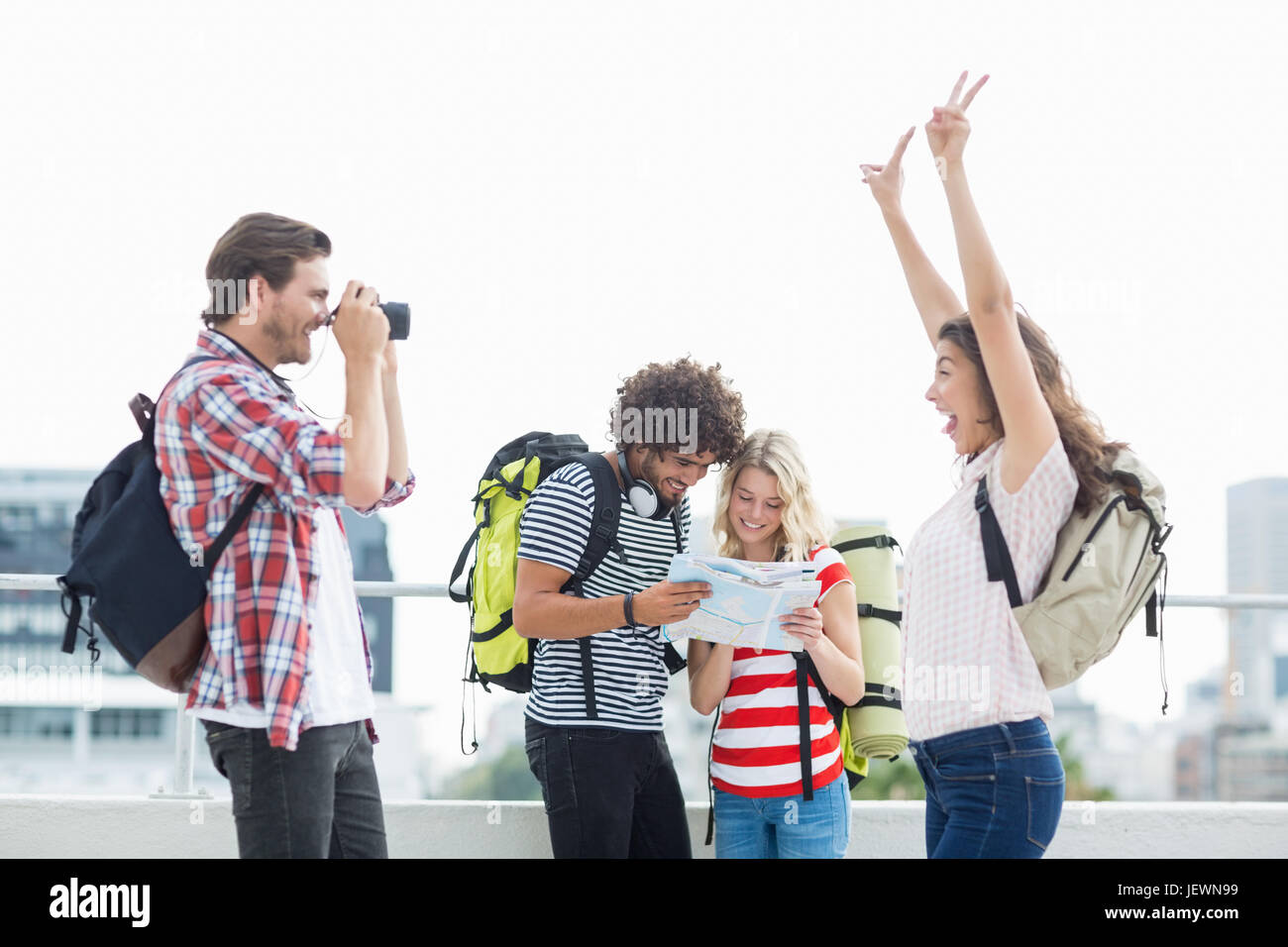 Man photographing woman on terrace Stock Photo - Alamy