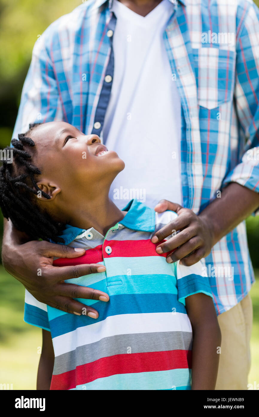 Young boy looking his father Stock Photo - Alamy