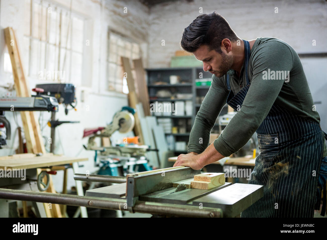 Carpenter working on his craft Stock Photo - Alamy