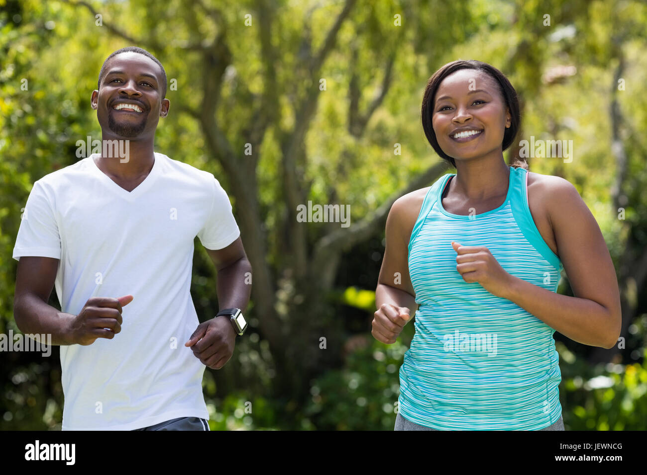 Happy couple posing together Stock Photo - Alamy