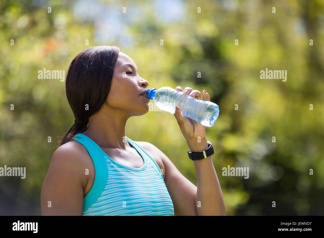 Woman drinking water Stock Photo - Alamy