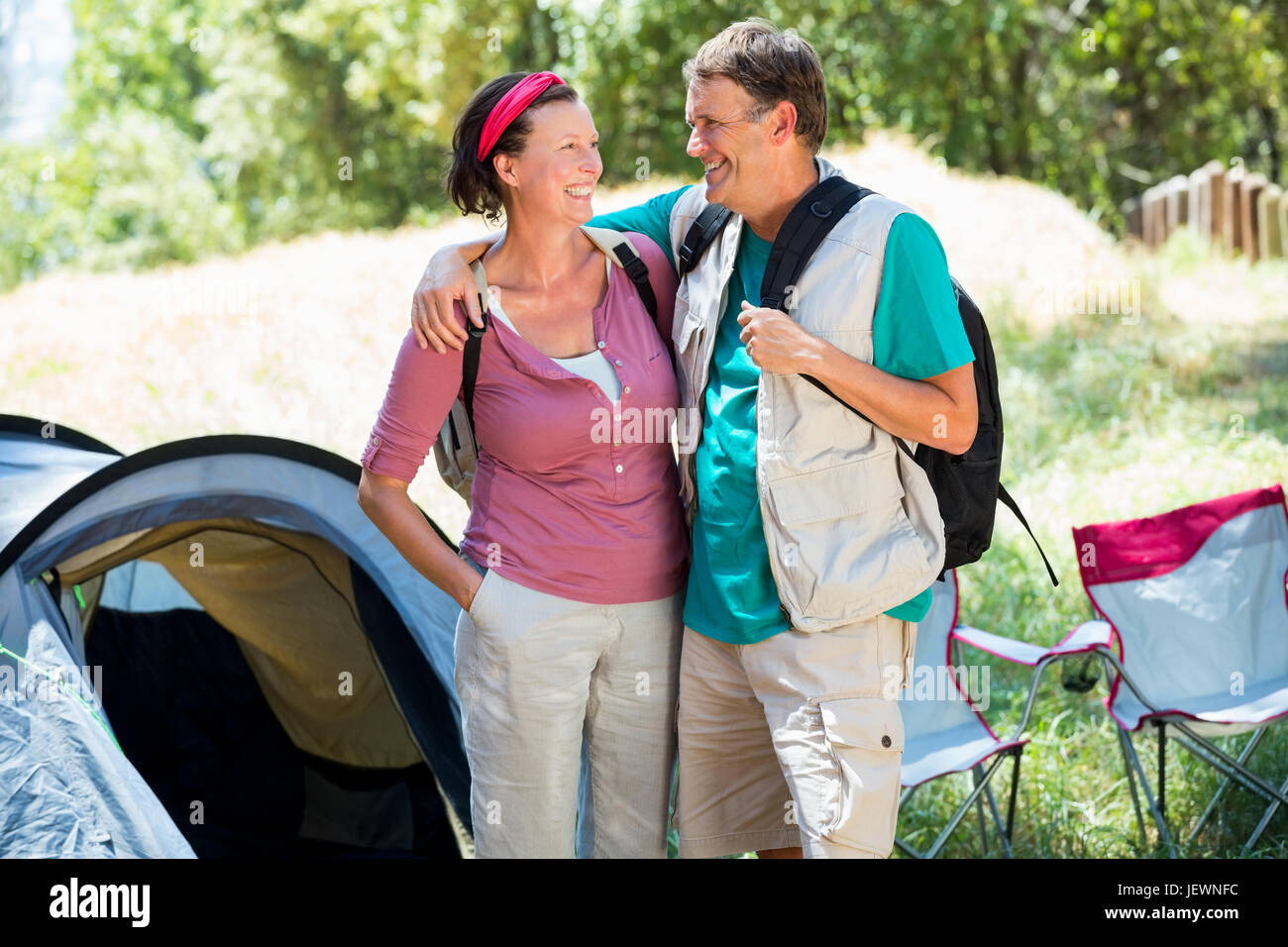Senior couple relaxing beside their tent Stock Photo - Alamy