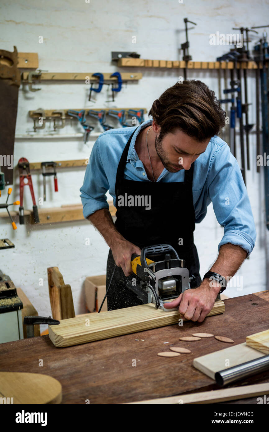 Carpenter working on his craft Stock Photo - Alamy