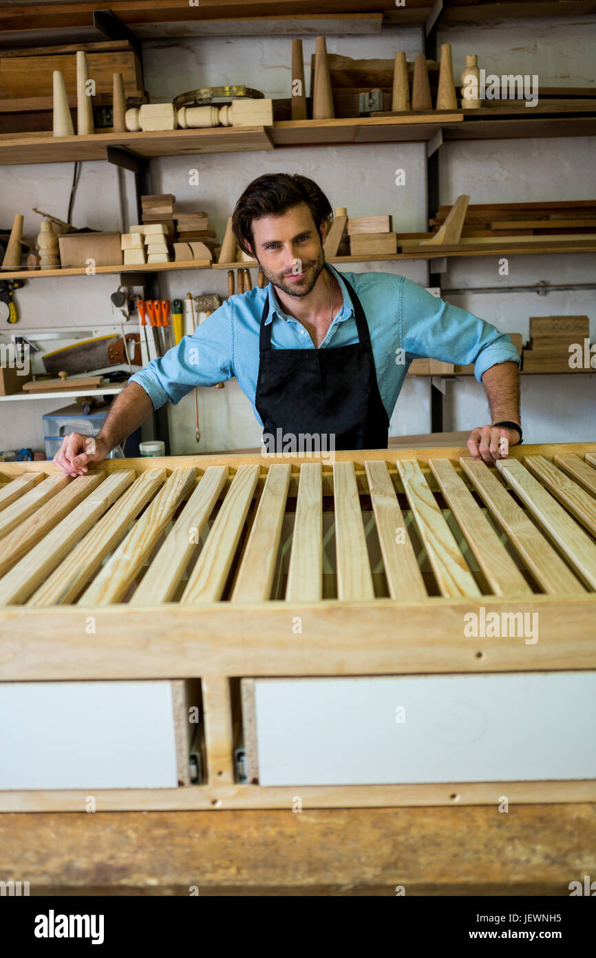 Carpenter is posing with his craft Stock Photo - Alamy