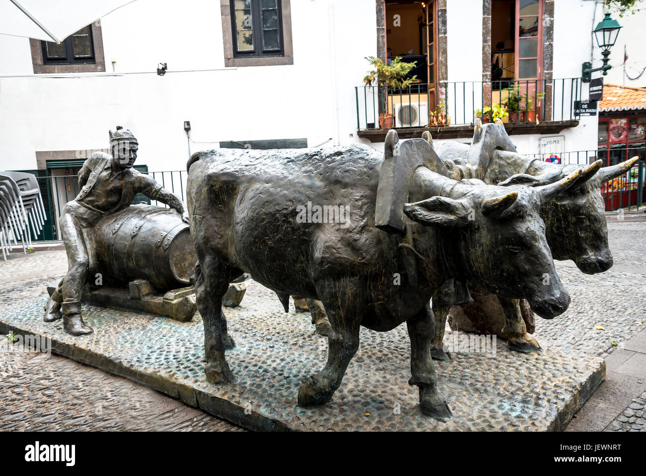 Bronze Statue of Oxen and their Driver pulling goods on wooden runners ...