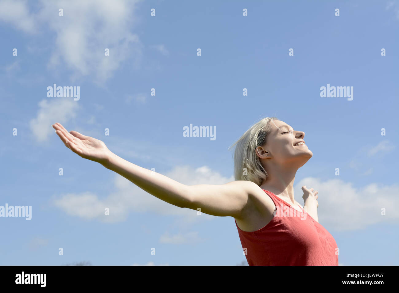 young woman cheering Stock Photo - Alamy