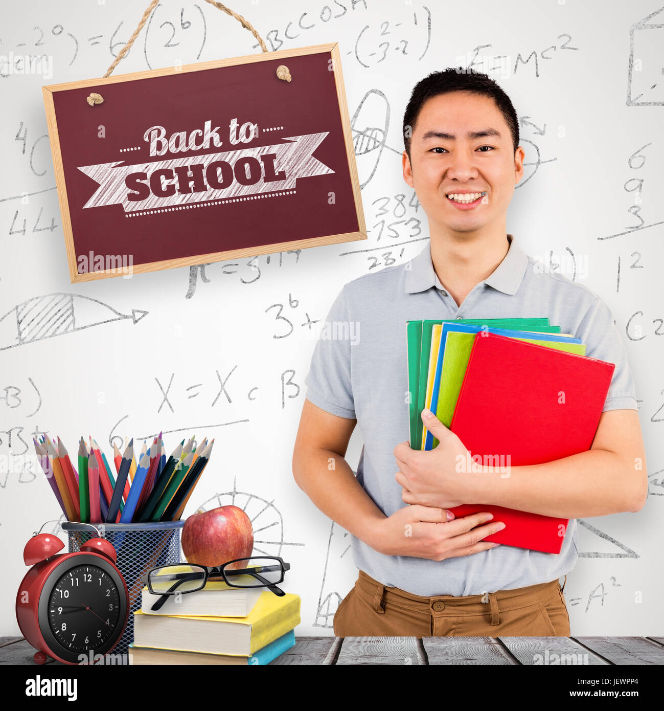 Composite image of smiling man holding files Stock Photo - Alamy