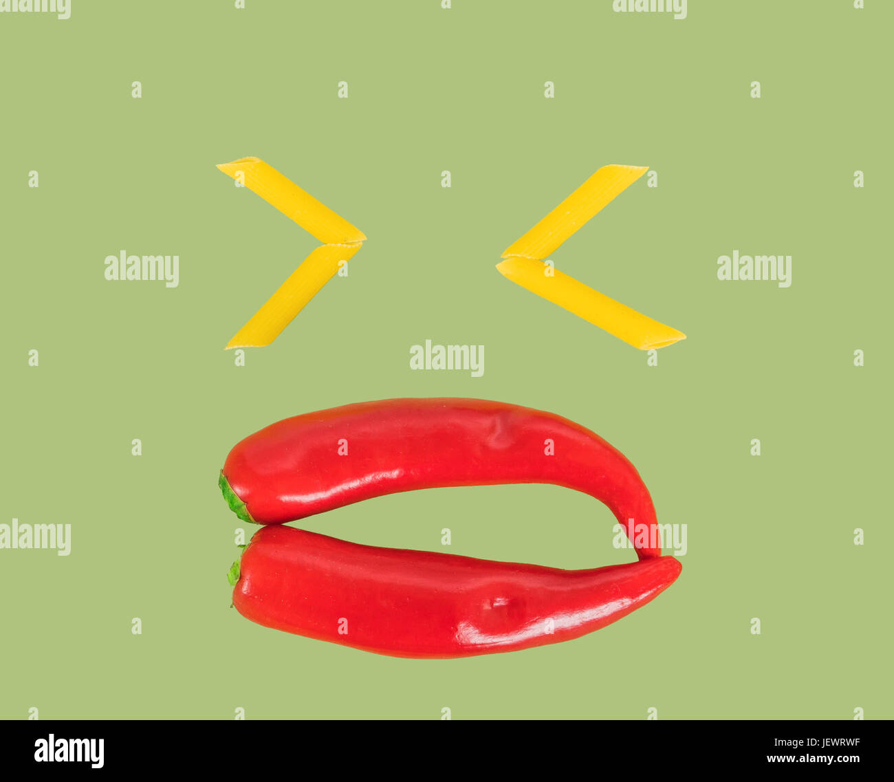 Facial expression when eaten spicy food. A face made of pasta and hot ...