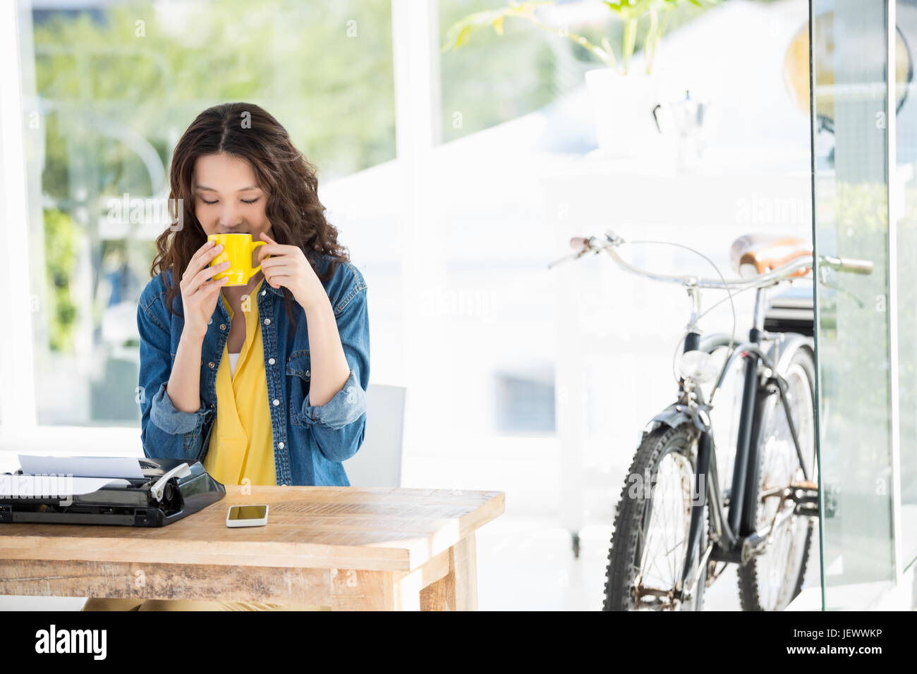 Hipster drinking coffee Stock Photo - Alamy