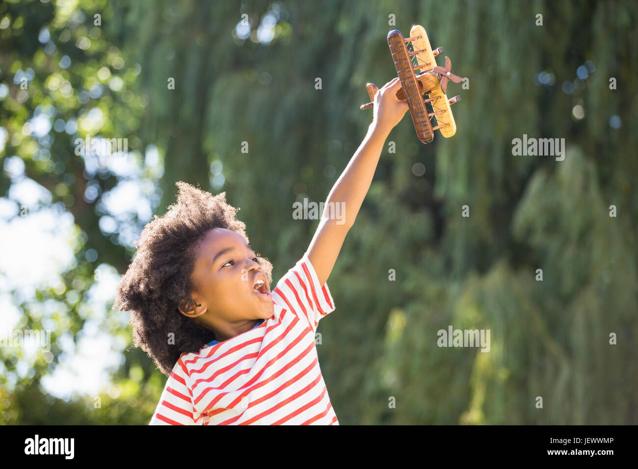 Boy flying paper airplane hi-res stock photography and images - Alamy