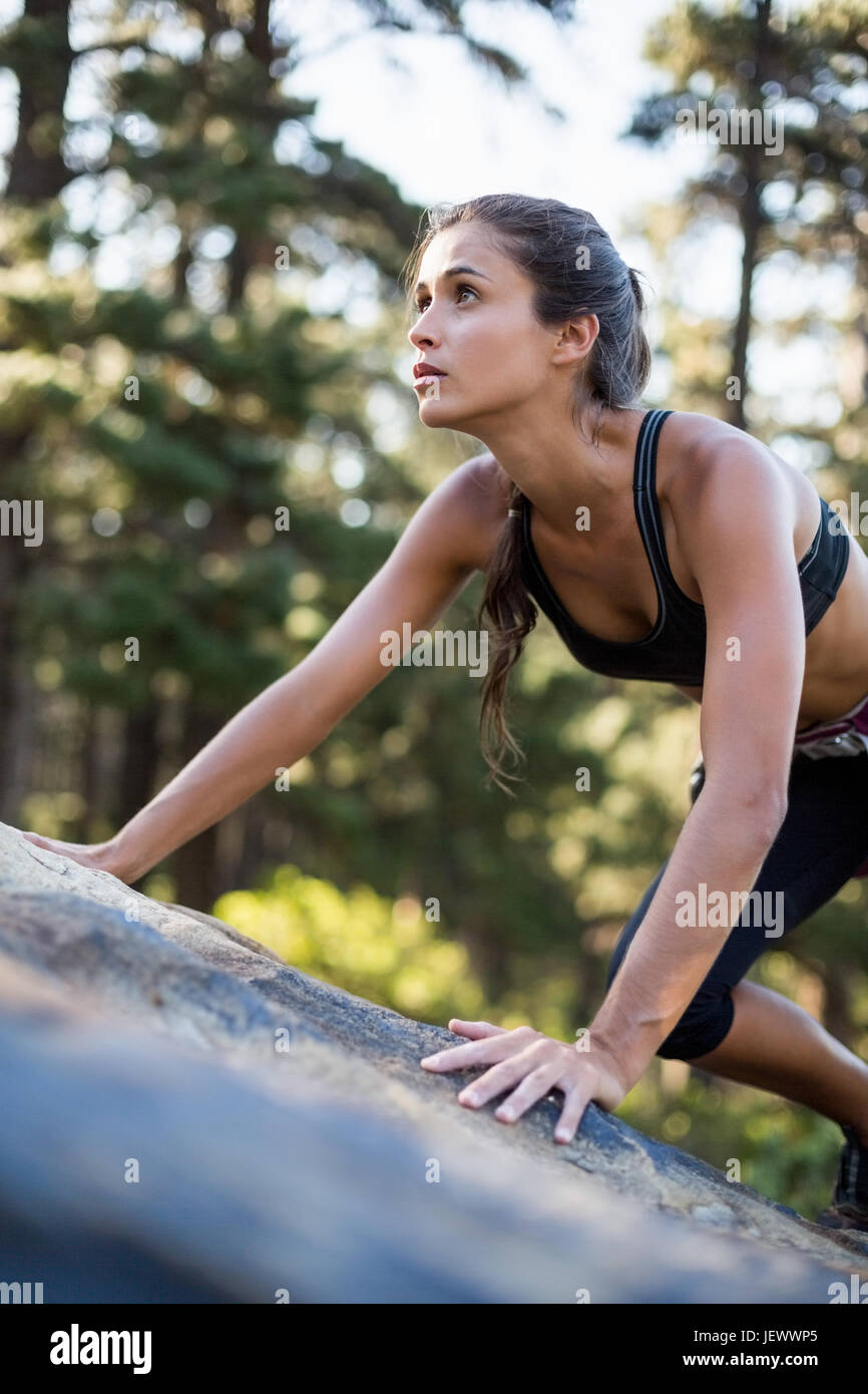 Portrait of woman rock climbing Stock Photo - Alamy