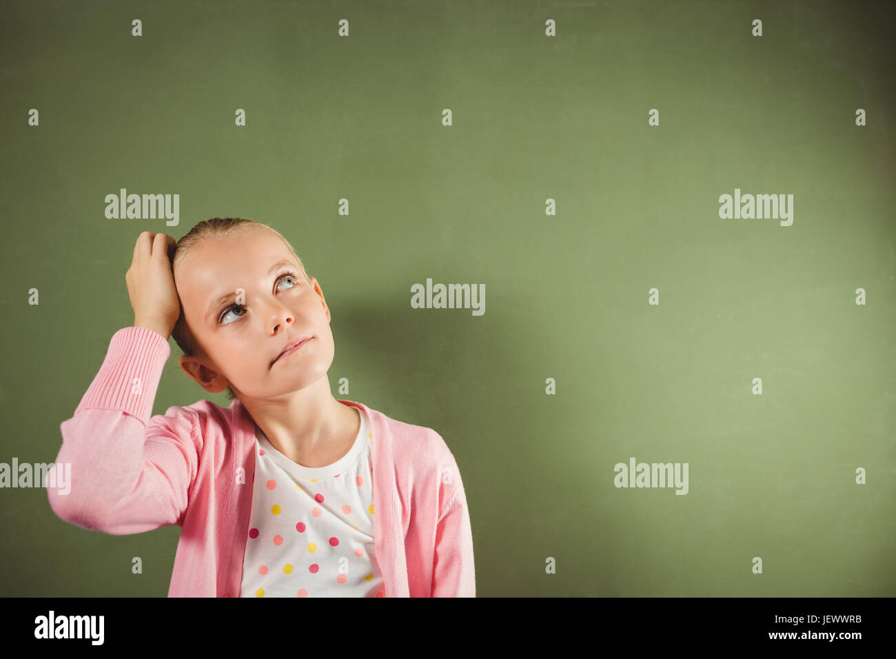 Girl touching her head Stock Photo - Alamy