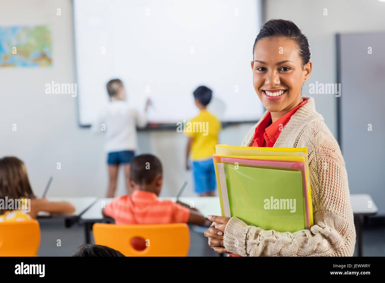 Male teacher smiling board hi-res stock photography and images - Alamy