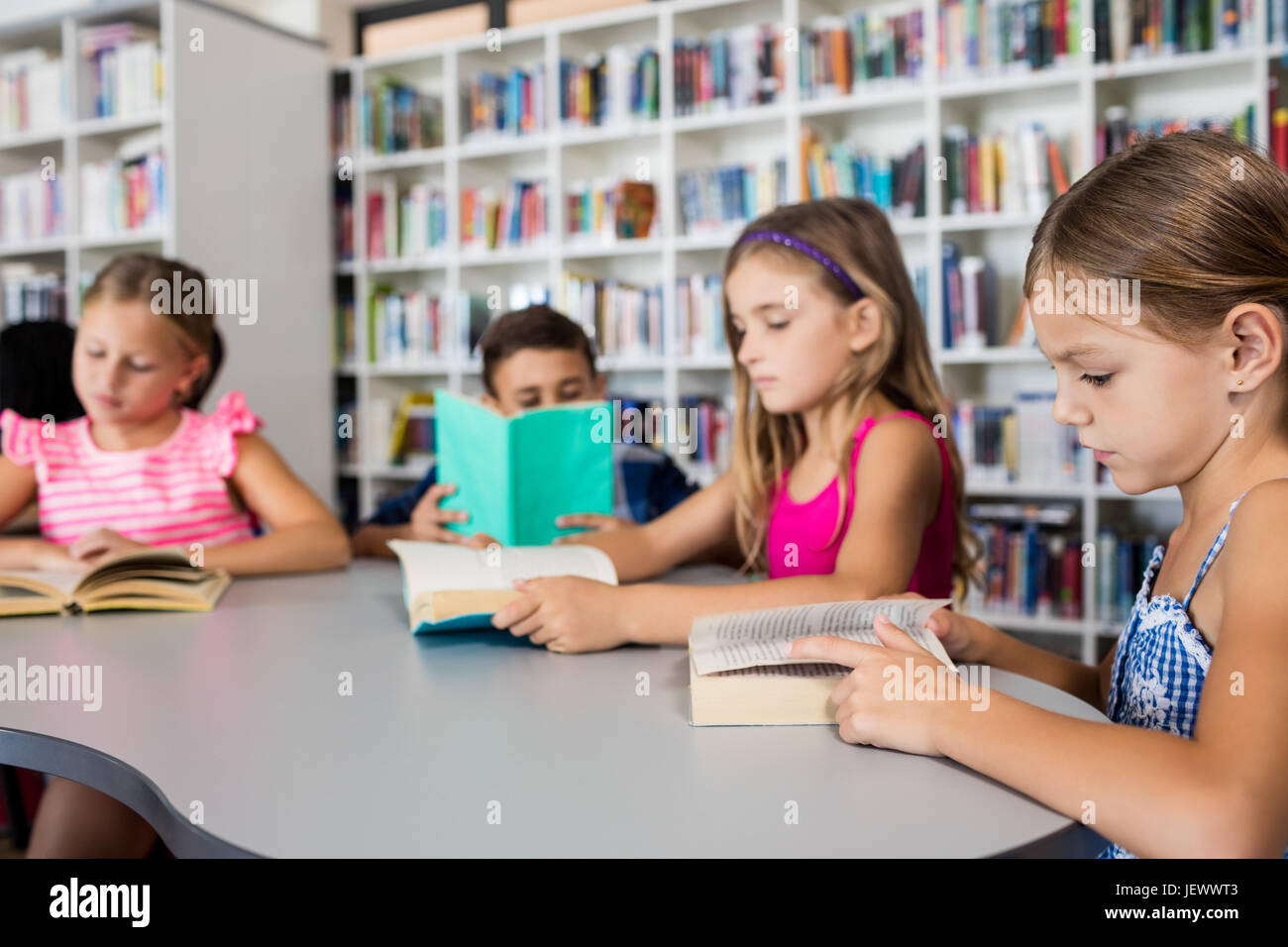 Pupils are reading books Stock Photo - Alamy