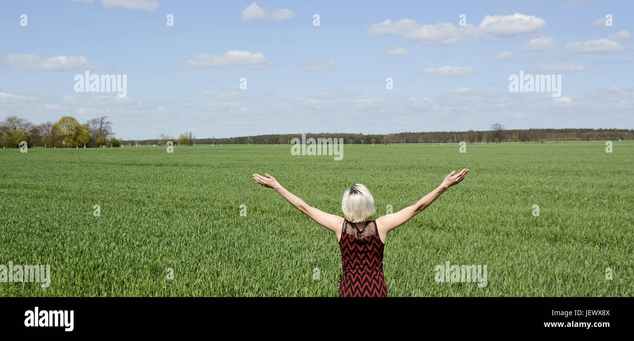 young blond beautiful woman cheering Stock Photo - Alamy