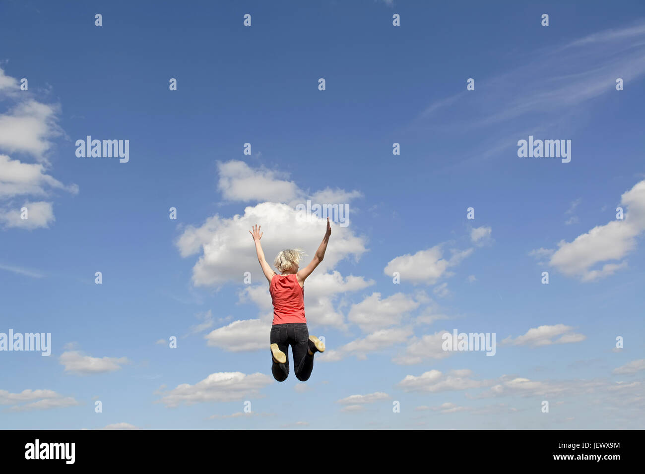 Leaping woman hi-res stock photography and images - Alamy
