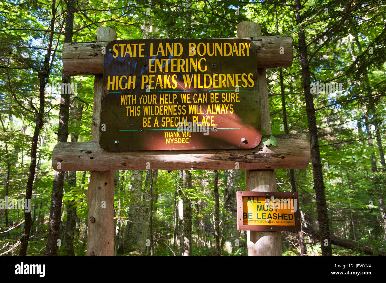 Wooden sign marking the state land boundary entering the High Peaks ...