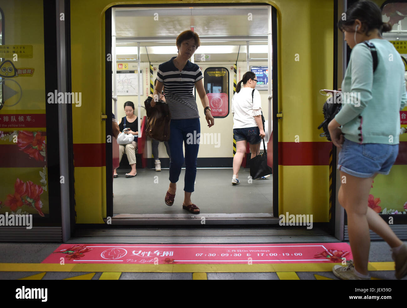 (170628) -- GUANGZHOU, June 28, 2017 (Xinhua) -- A woman steps out of ...