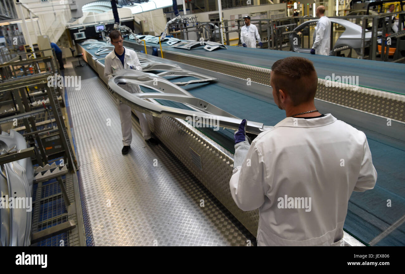 Volkswagen cars are assembled on a production line in the German car ...