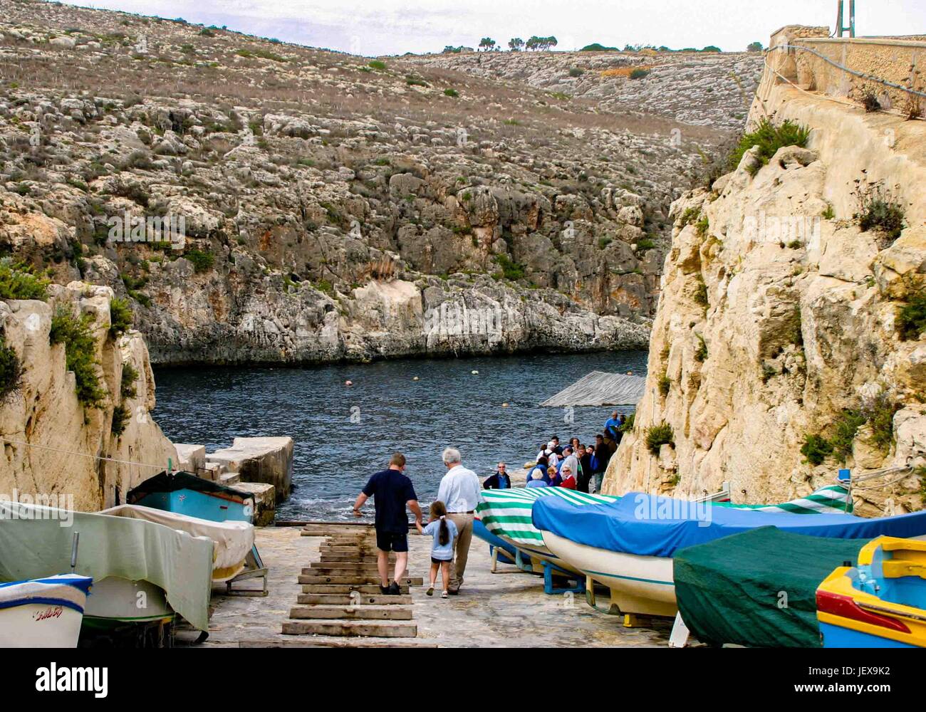 September 27, 2004 - Zurrieq Village, Malta - A tourist family walks ...