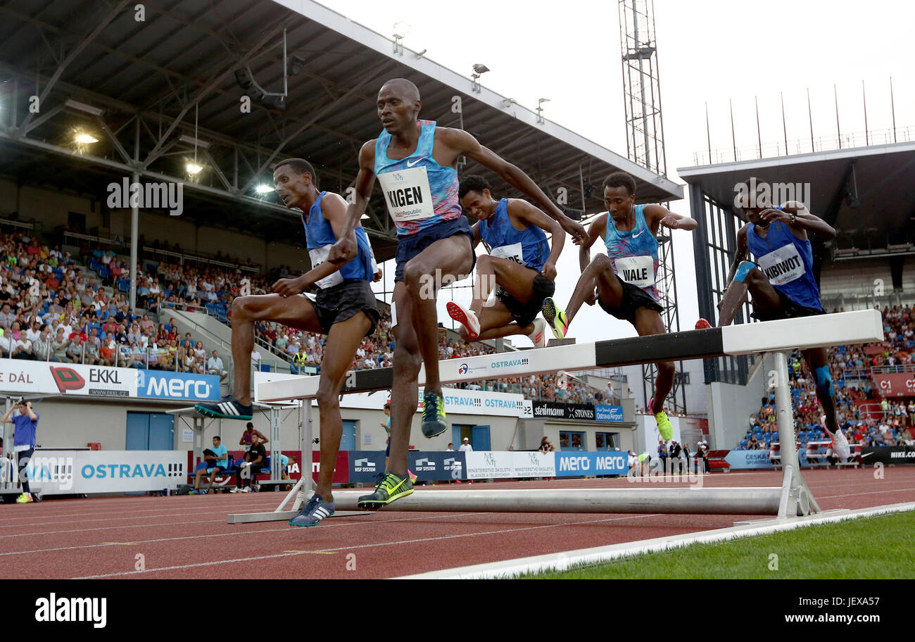 Kenyan athlete Benjamin Kigen (front) competes in the 3000 metres ...