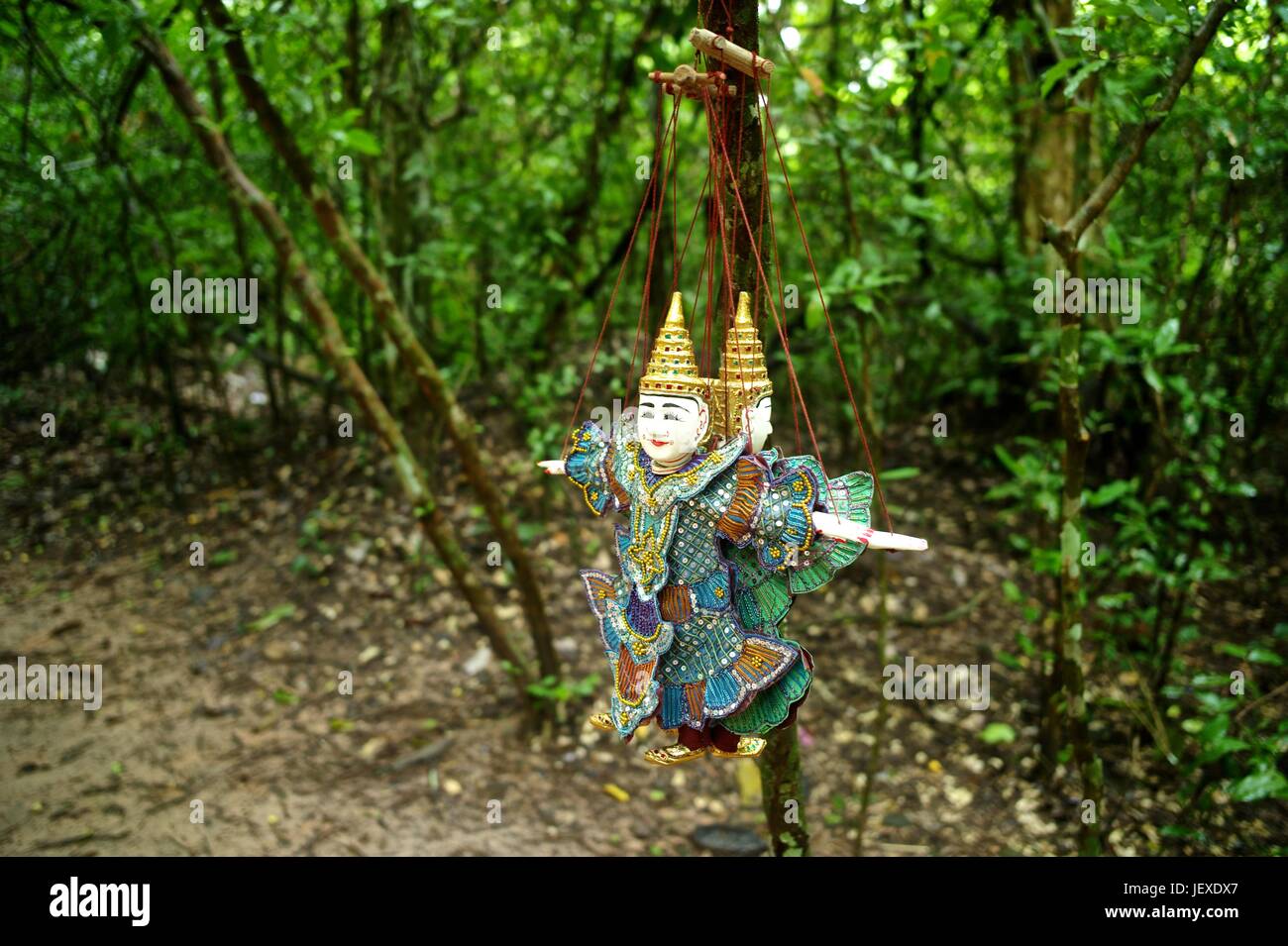 Traditional Khmer puppets at the entrance of the ancient ruins of Ta ...