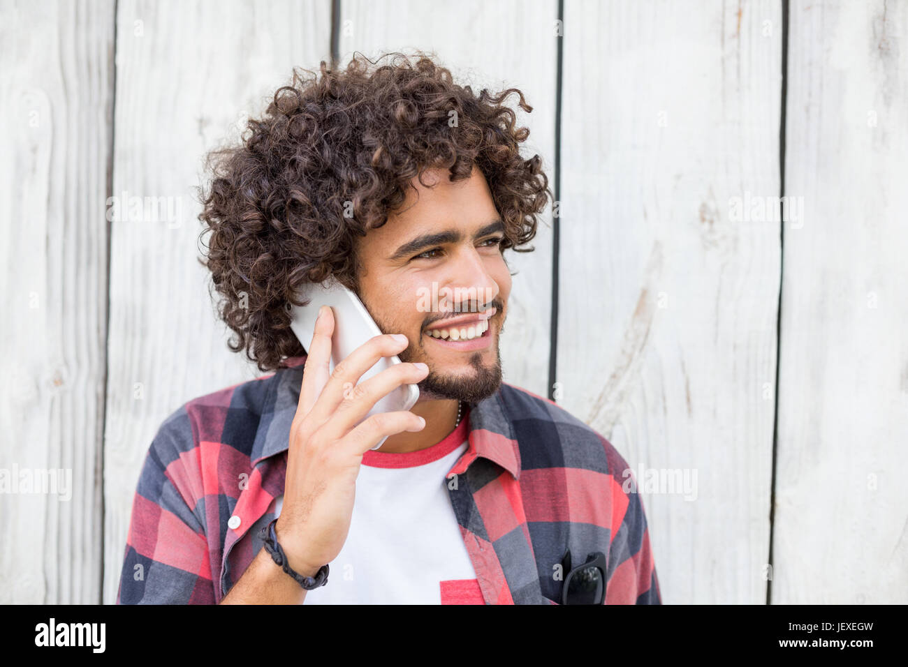 Young man talking on mobile phone Stock Photo - Alamy
