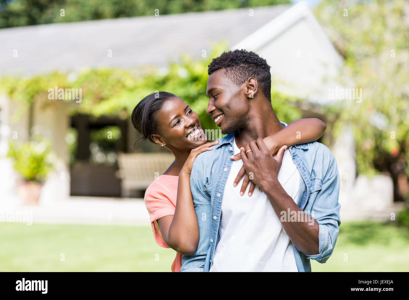 Happy couple posing together Stock Photo - Alamy
