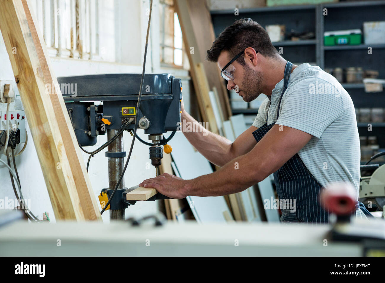 Carpenter using a drill Stock Photo - Alamy