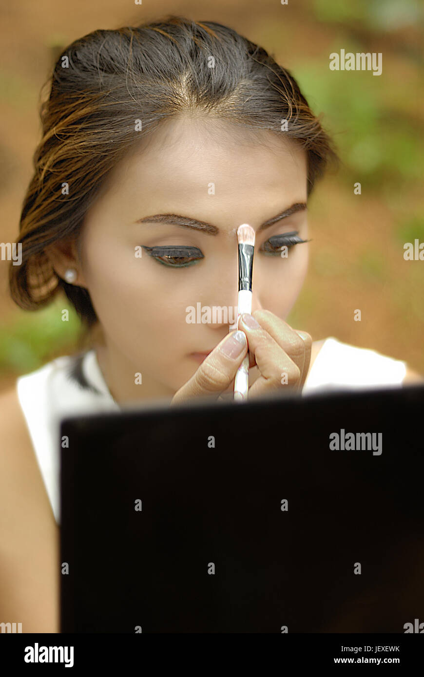 Beautiful woman doing face hi-res stock photography and images - Alamy