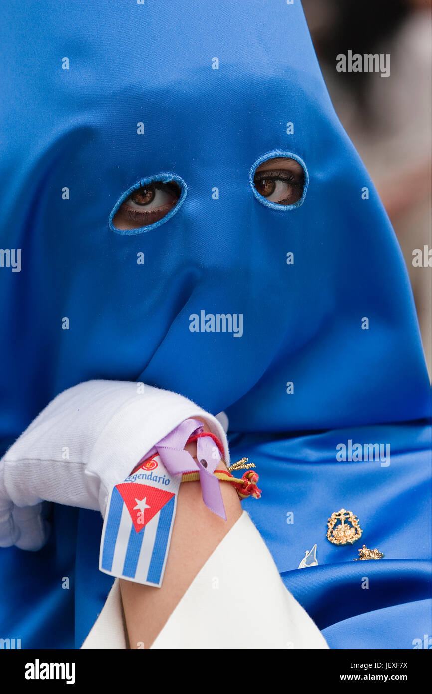 Penitent with caperuz blue of penetrating look and nice eyes during a ...