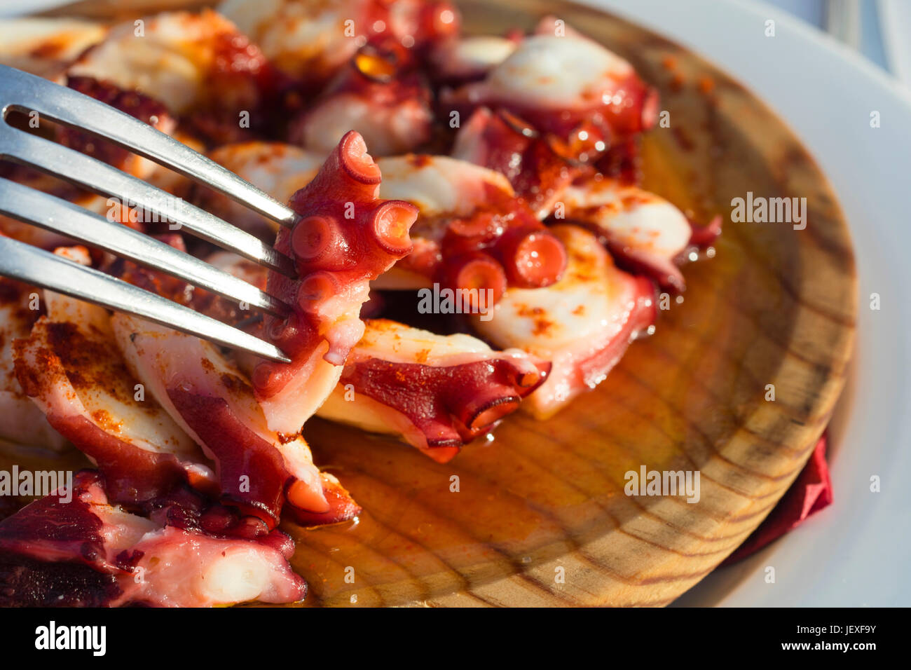 Detail of galician octopus and a fork Stock Photo - Alamy