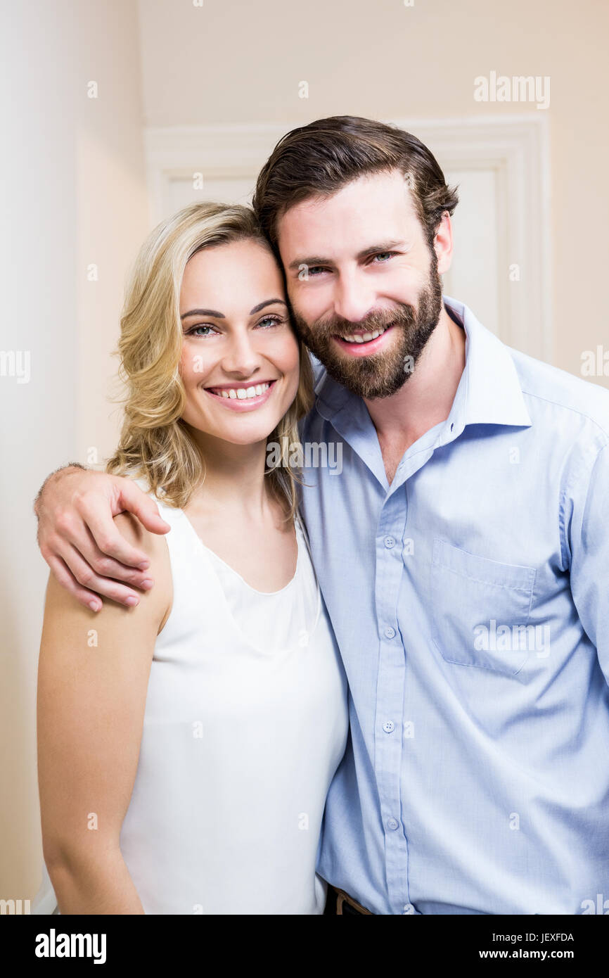 Attractive couple standing arm hi-res stock photography and images - Alamy