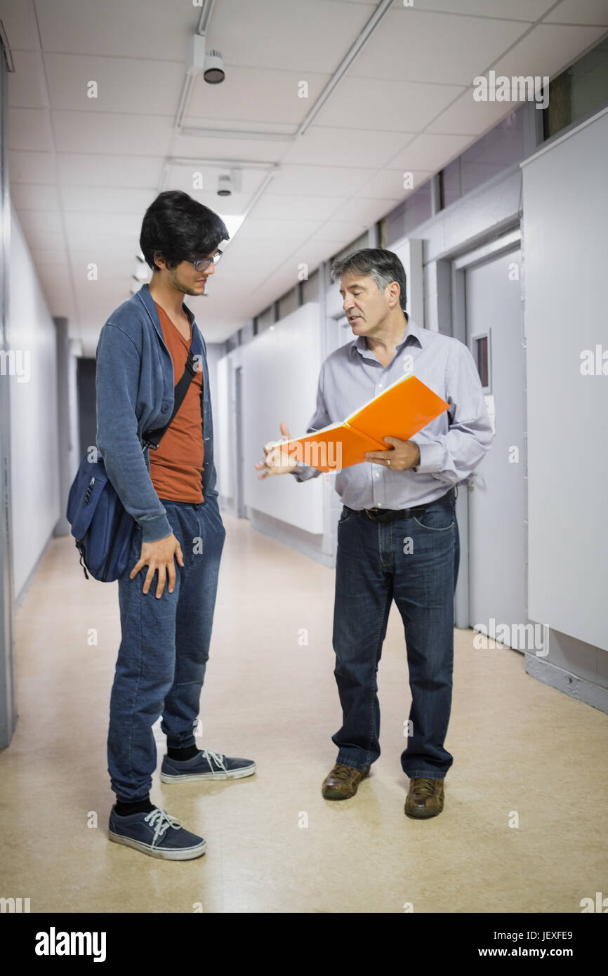 Teacher student talking hallway hi-res stock photography and images - Alamy