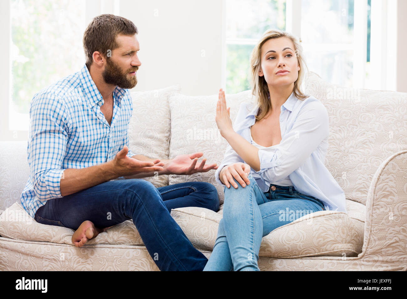 Upset couple arguing with each other Stock Photo - Alamy