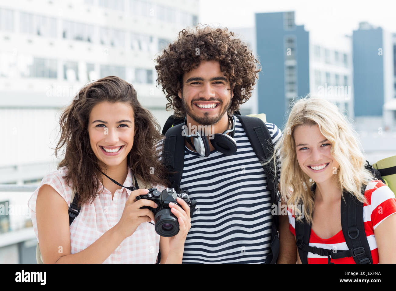 Portrait of friends on terrace Stock Photo - Alamy