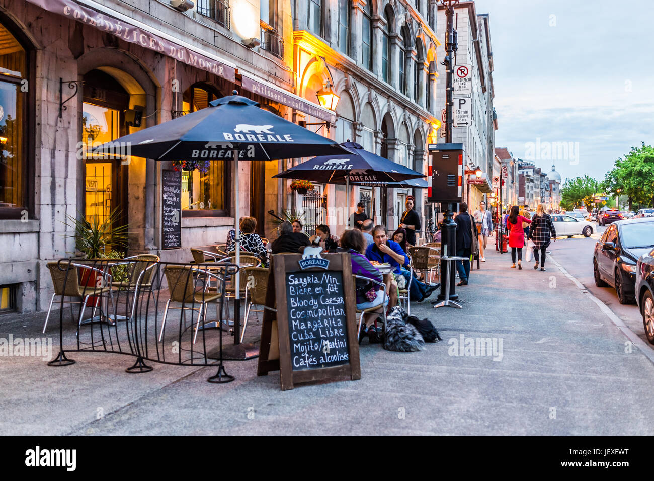 Montreal, Canada - May 27, 2017: Old town area with people sitting by ...