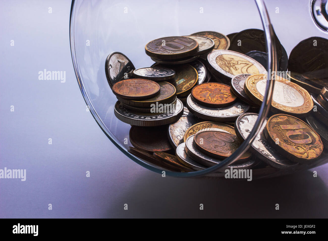 coins and glass Stock Photo - Alamy