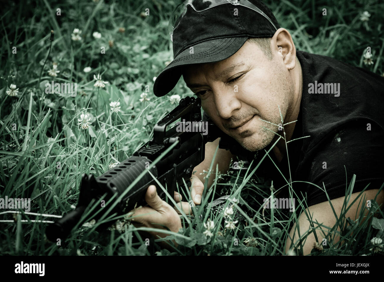 The man holding a gun k44 and shooting at afternoon, to a target ...