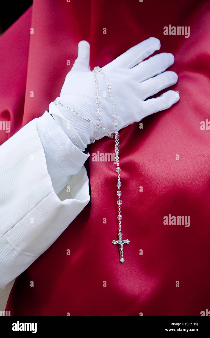 Penitent with a rosary in his hand in a procession, Spain Stock Photo ...