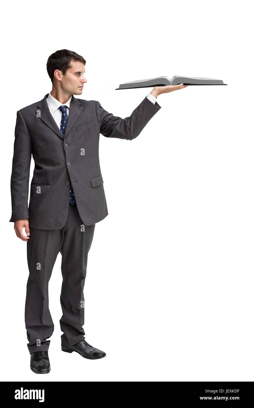 Businessman showing a book Stock Photo - Alamy