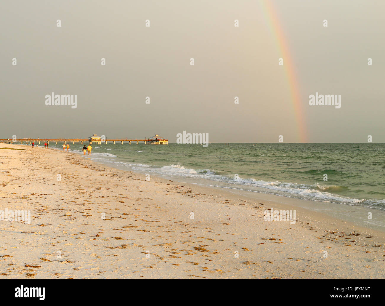 Rainbow On The Beach Stock Photo - Alamy