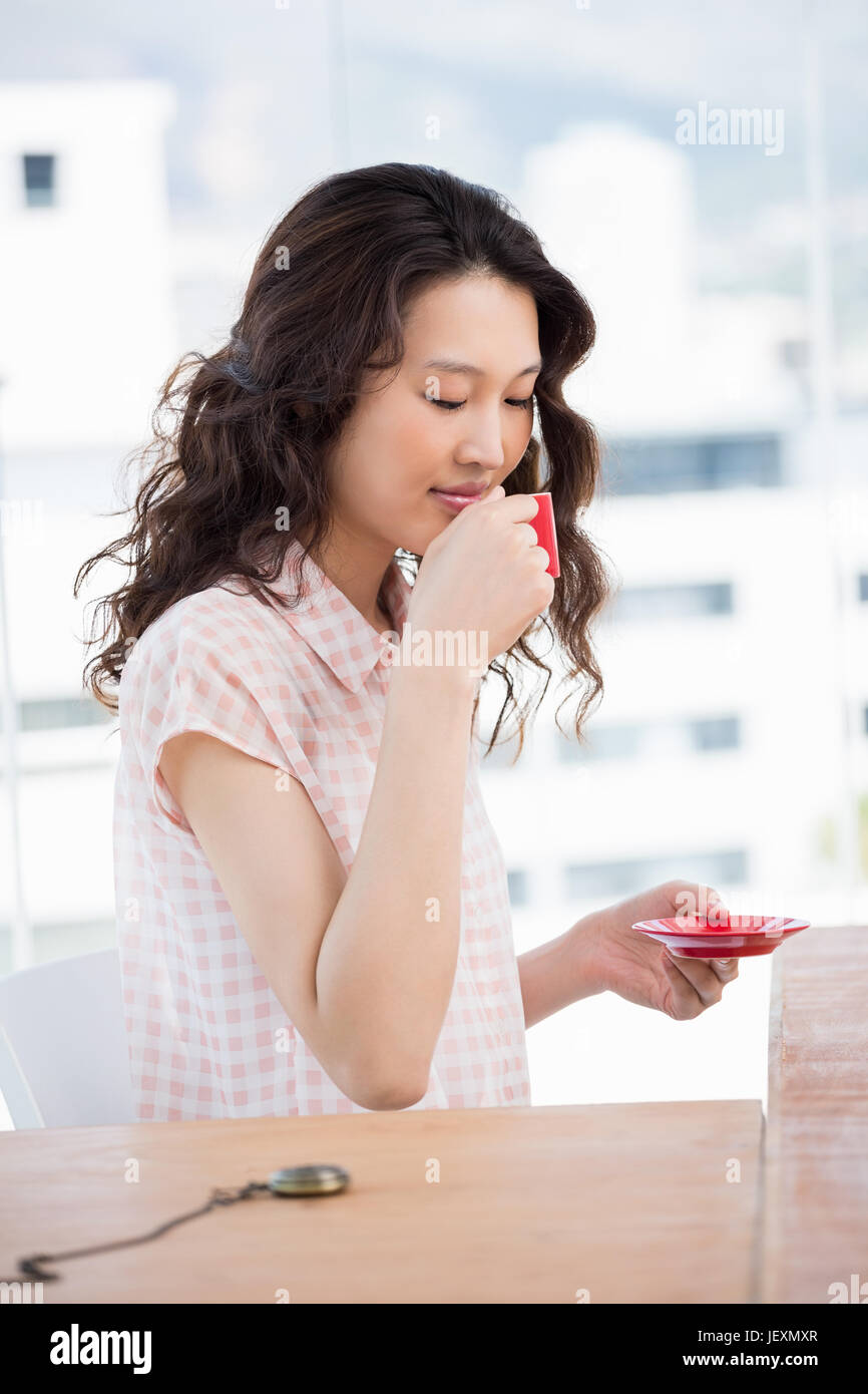 Hipster woman drinking a coffee Stock Photo - Alamy
