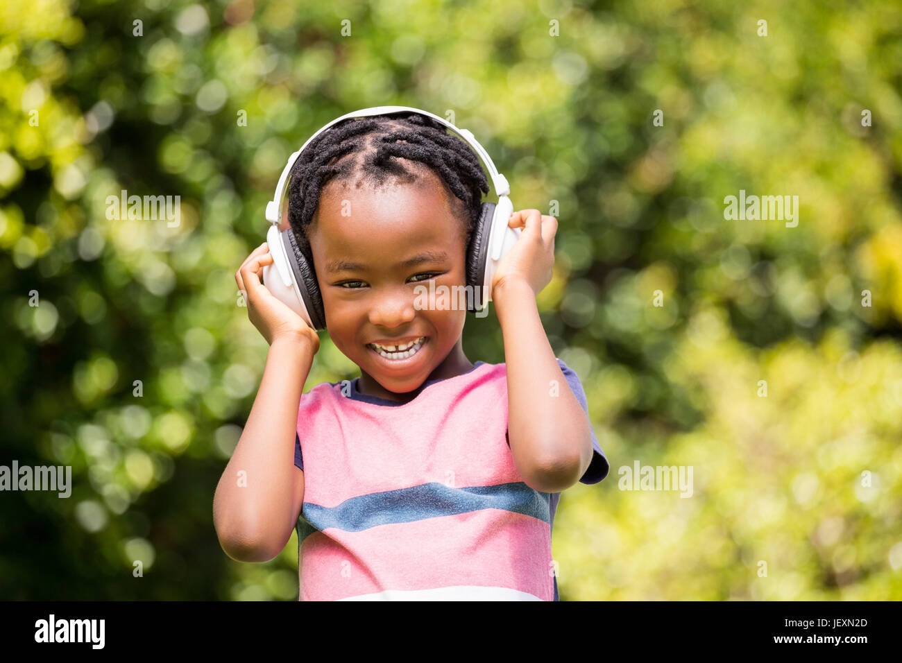 Boy smiling listening music hi-res stock photography and images - Alamy